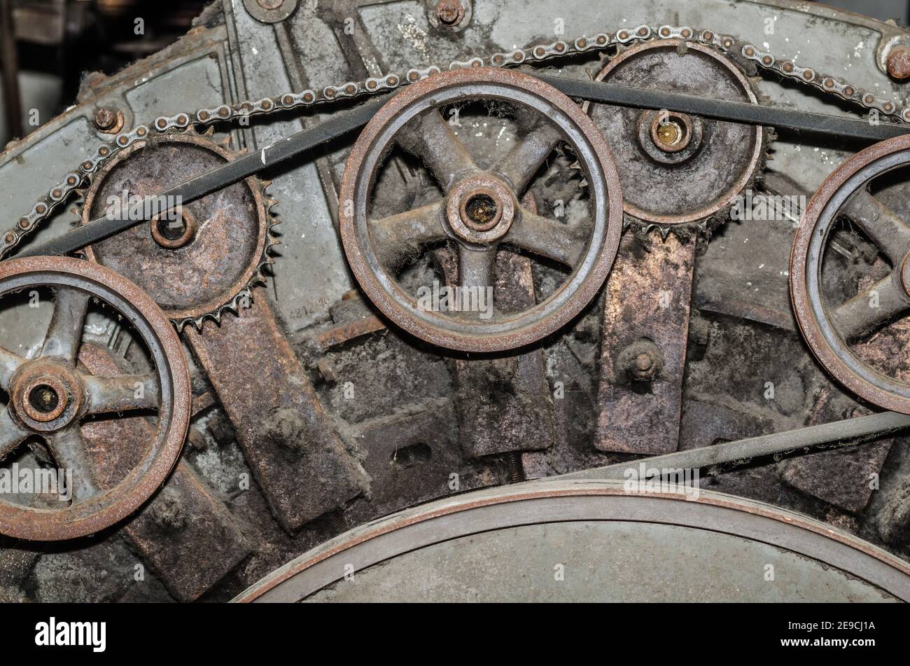old factory engine and many wheels with chain Stock Photo - Alamy
