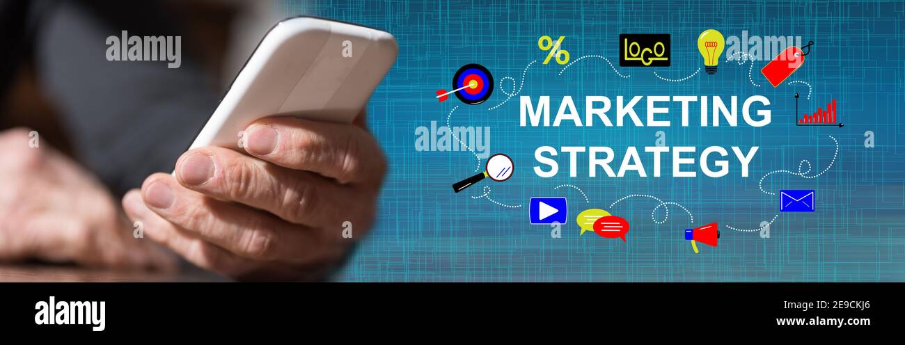Hand holding mobil phone with marketing strategy concept on background ...