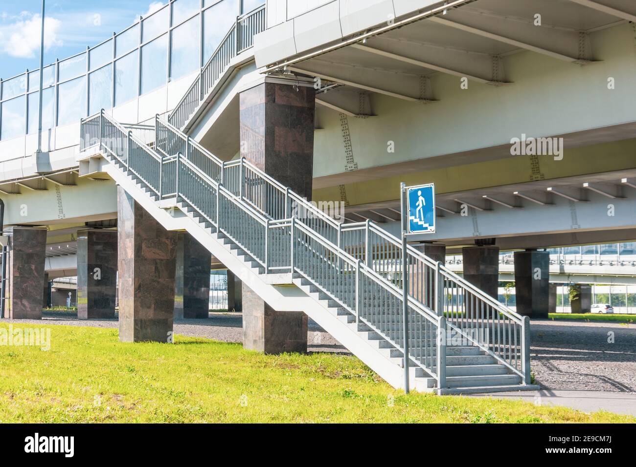 Pedestrian crossing over the bridge over the road. The sign of the ...