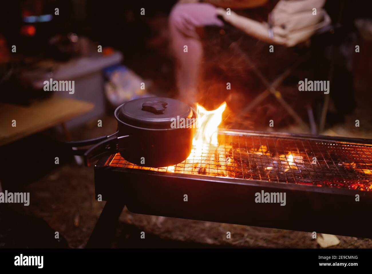Sparking bonfire with tourist people sit around bright bonfire near ...