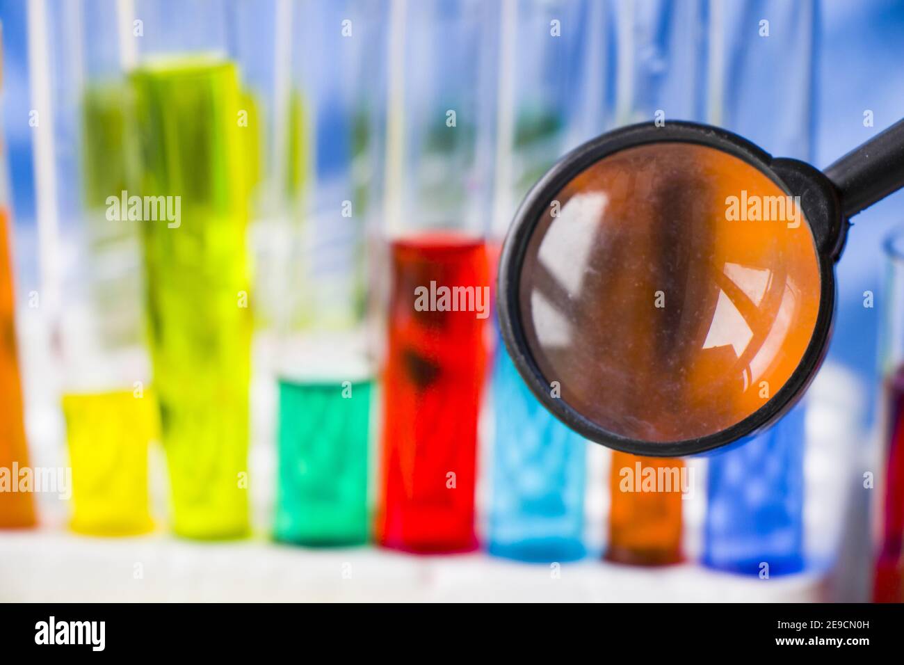 Closeup of chemicals in tubes through a magnifier in a laboratory Stock ...