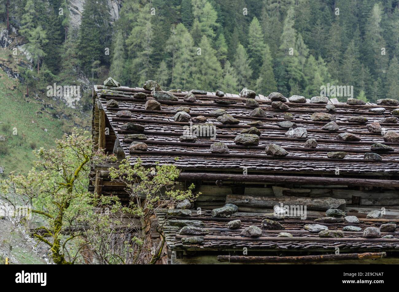roof with stones from a mountain chalet Stock Photo - Alamy