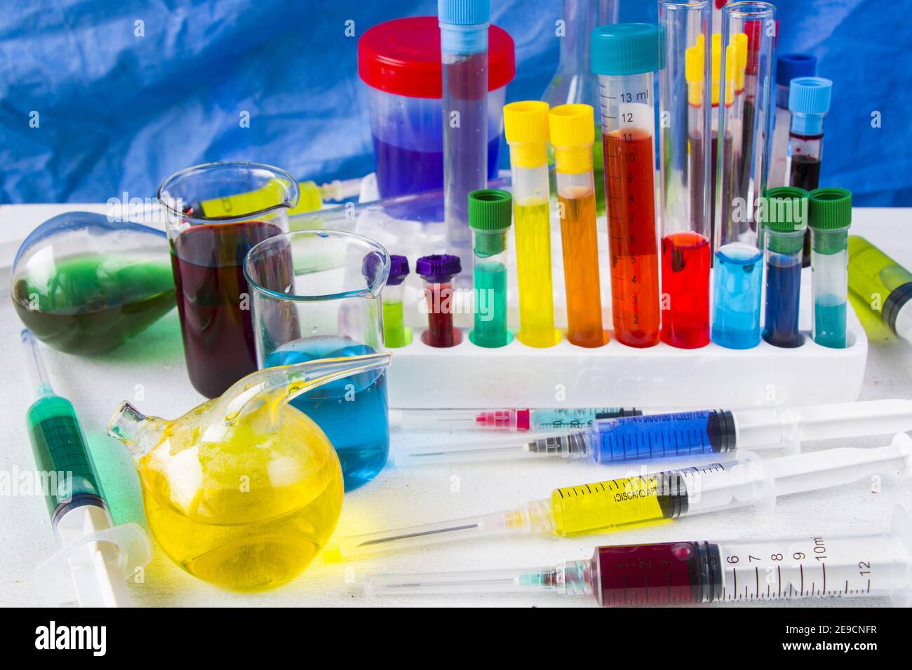 Closeup of syringe needles with chemical containers on the table in a ...