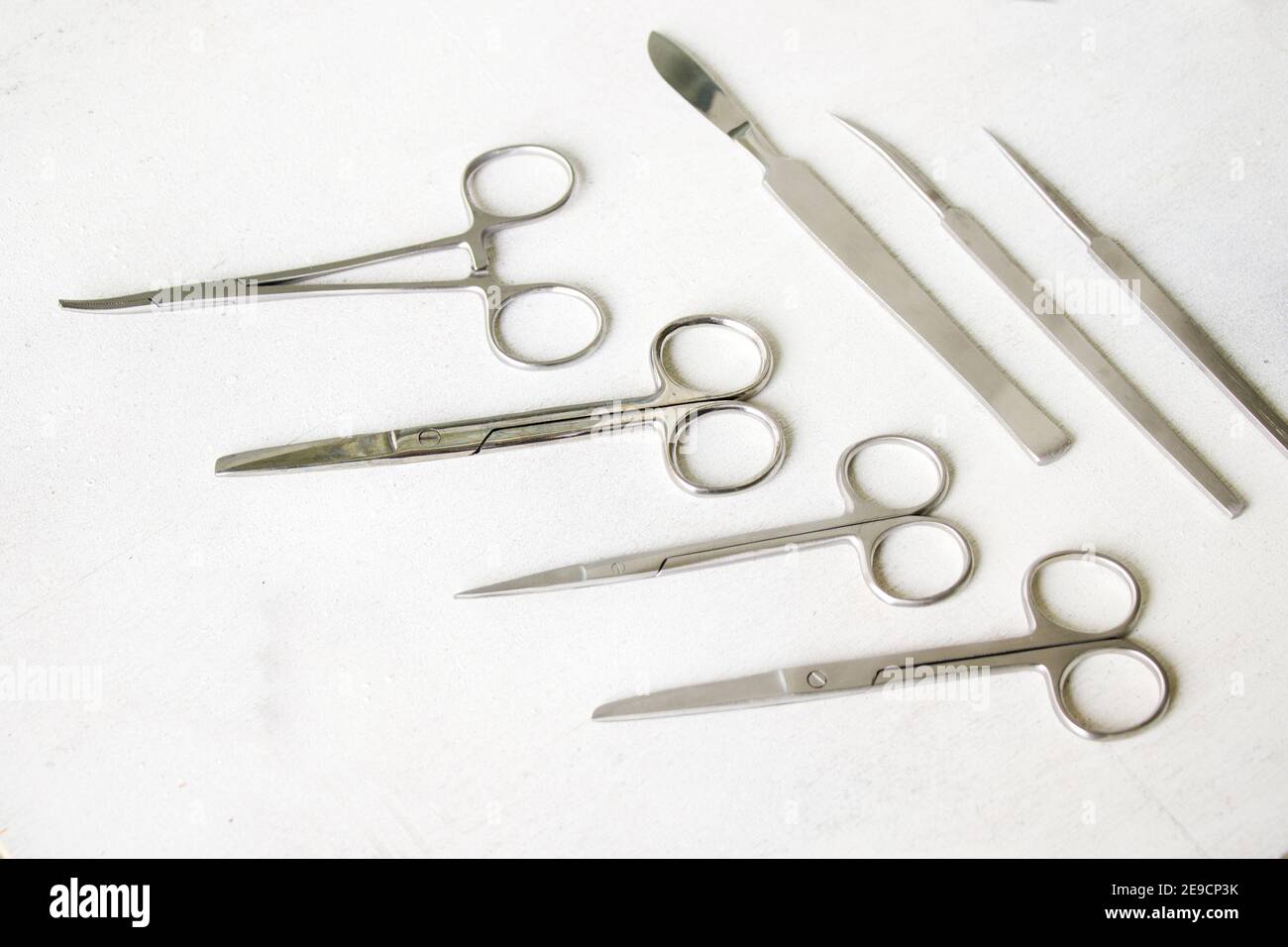 High angle shot of a dissection kit on a white surface under the lights ...
