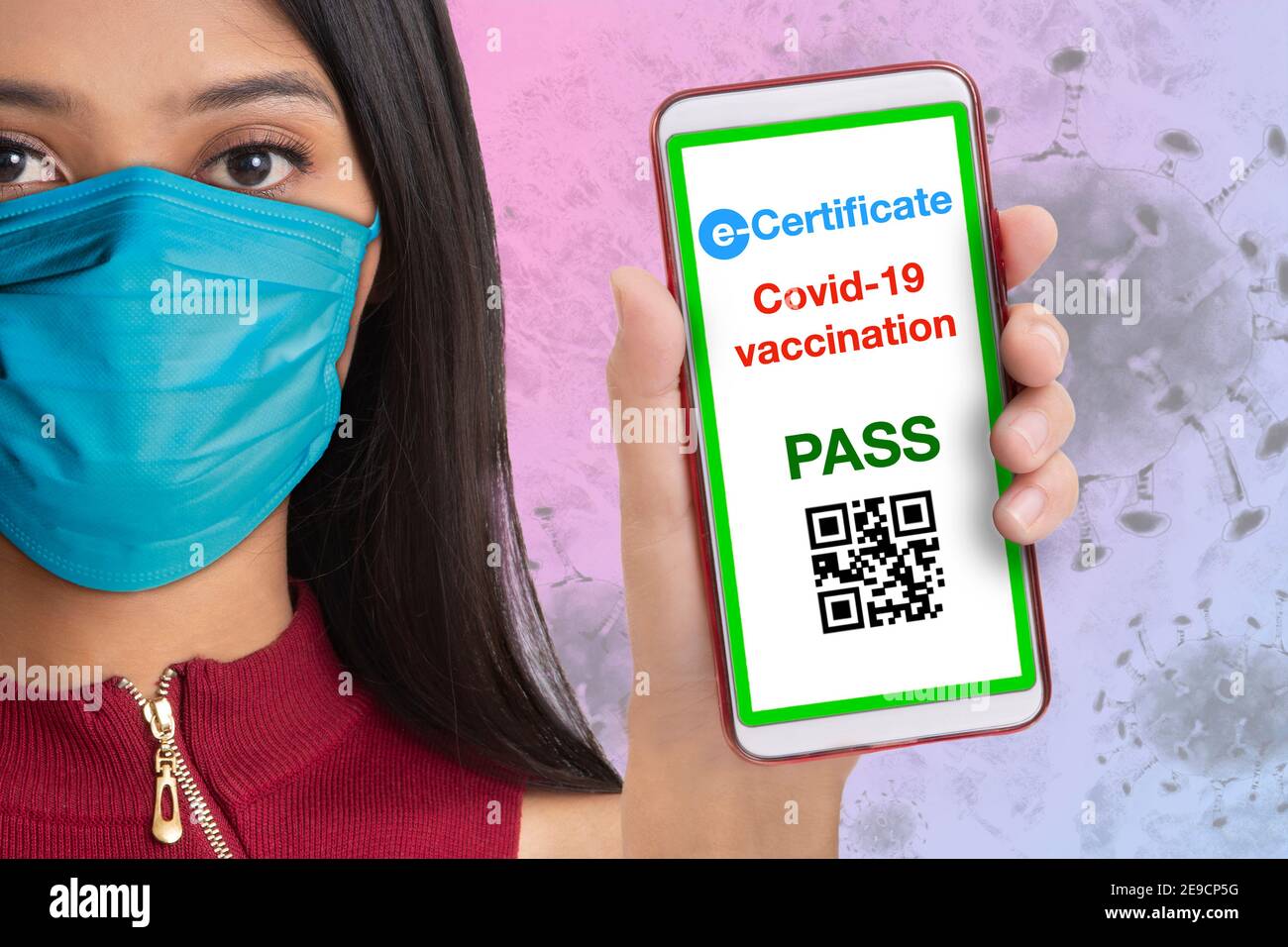 Woman wearing face mask showing electronic covid-19 vaccineation ...