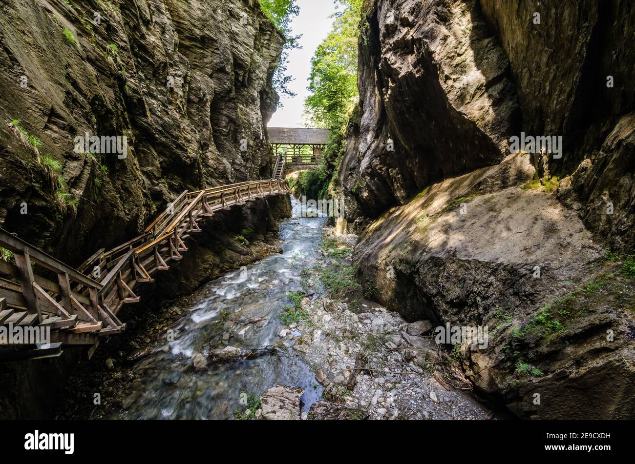 ravine with wooden stairs and wild water in nature Stock Photo - Alamy