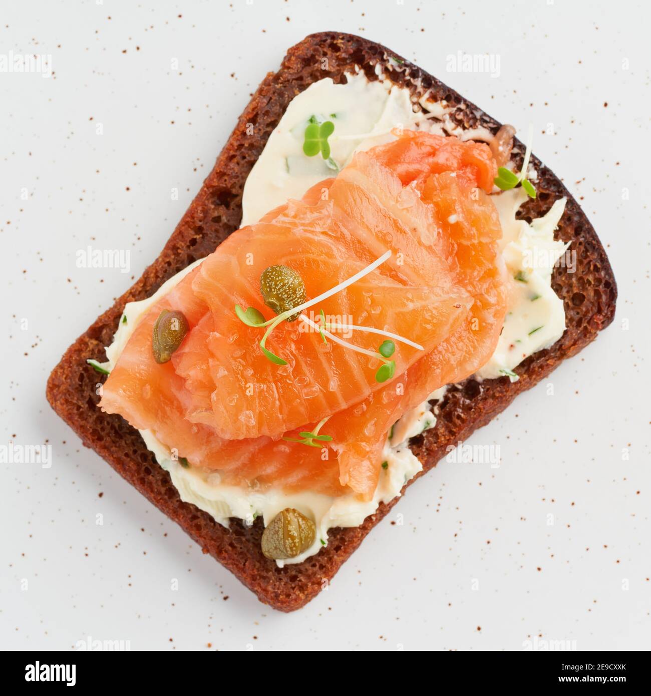 Smorrebrod - traditional Danish sandwiches. Black rye bread with salmon Stock Photo - Alamy