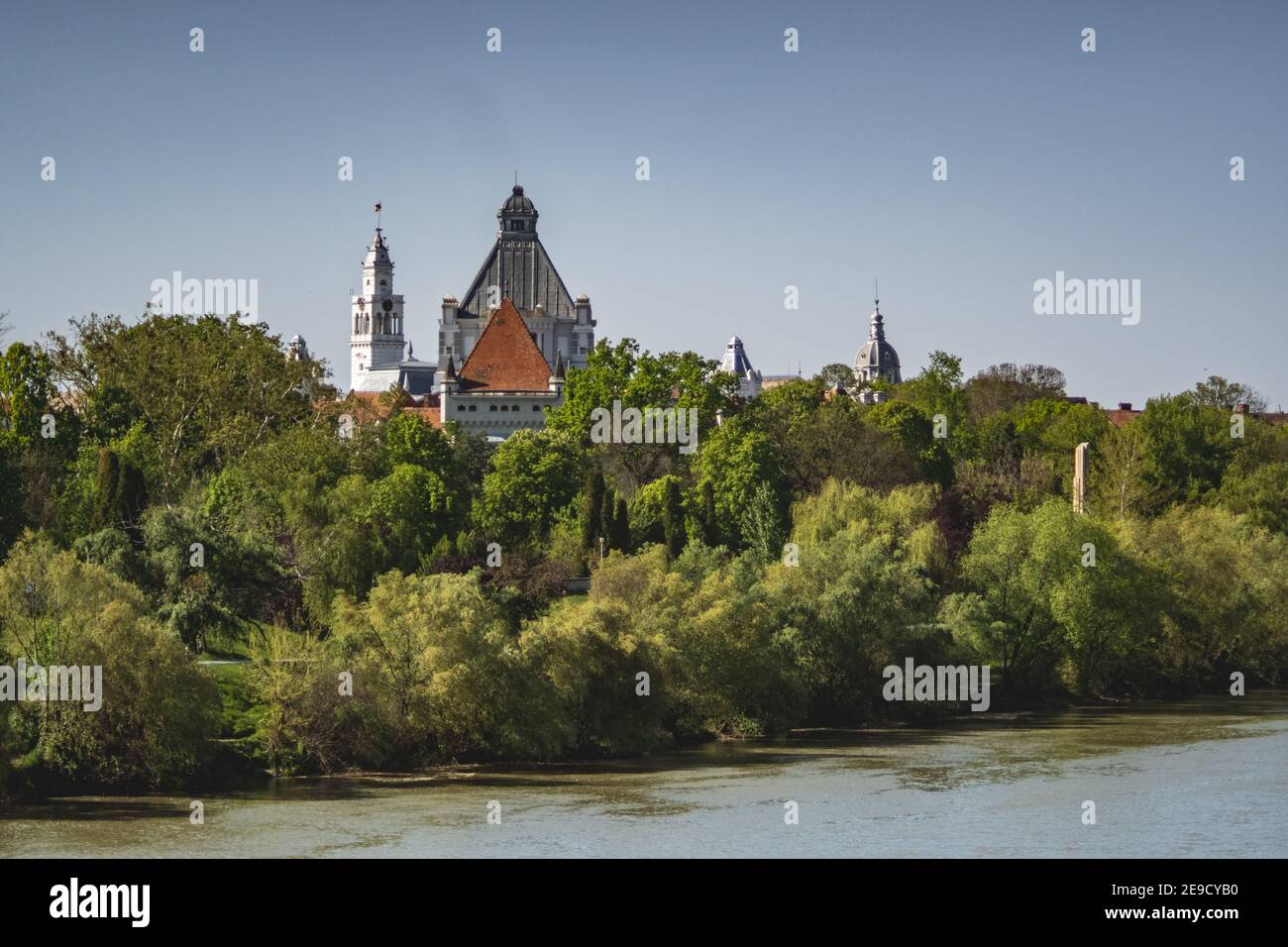 Old castle surrounded by trees near the Mures river in Romania Stock ...