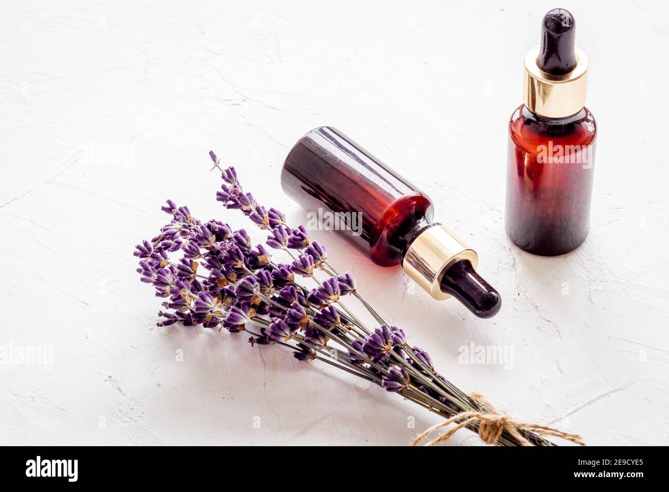 Bottles with lavender essential oil and herbs, close up Stock Photo - Alamy