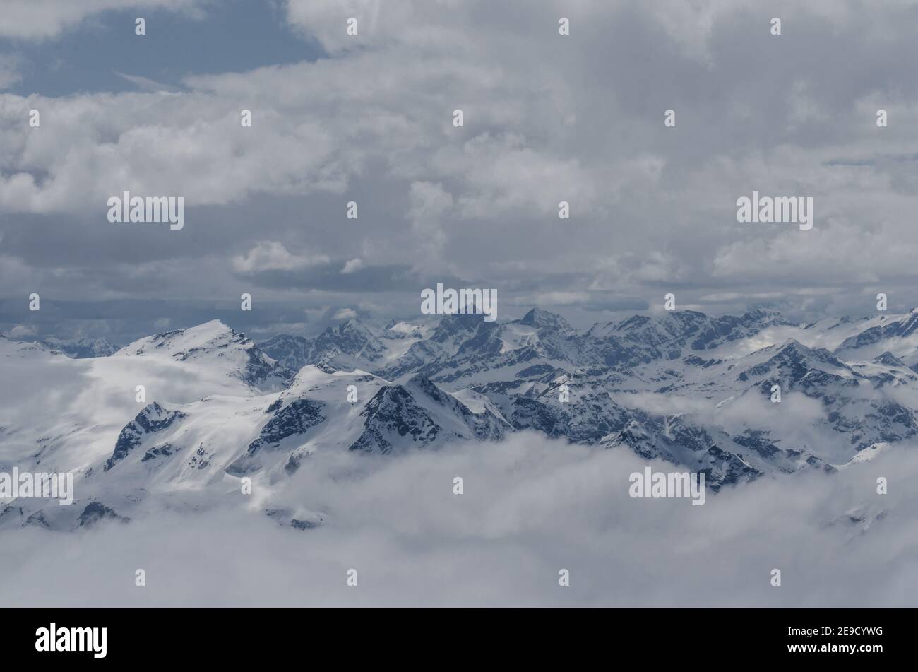 high mountain chain with many mountains and snow Stock Photo - Alamy