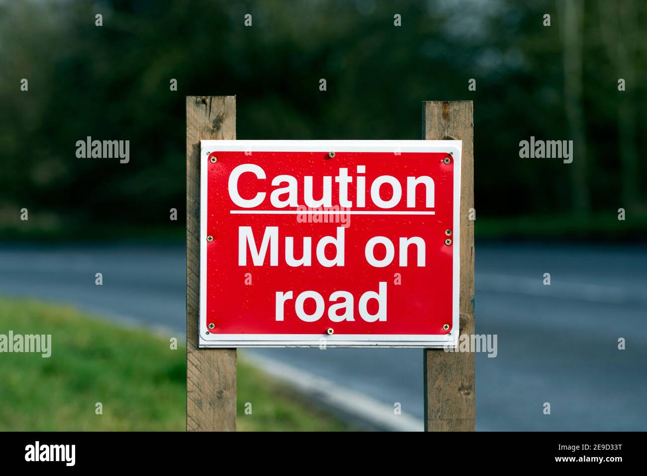 Caution Mud on road sign, Warwickshire, UK Stock Photo - Alamy