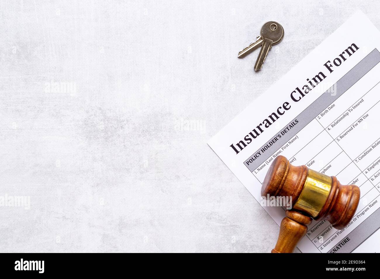 Insurance claim form with judge gavel . Top view Stock Photo - Alamy