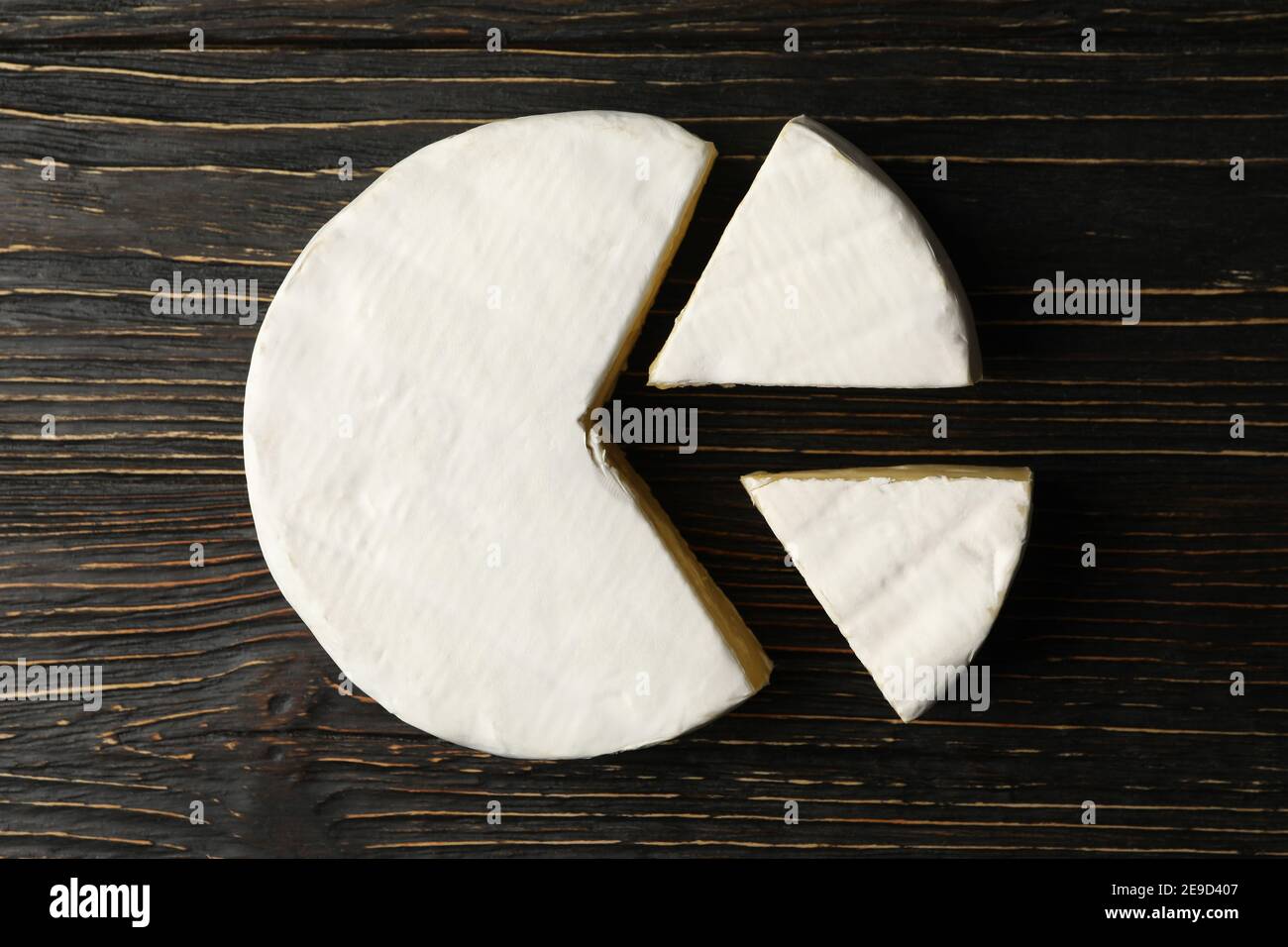Delicious camembert cheese on wooden background, top view Stock Photo ...