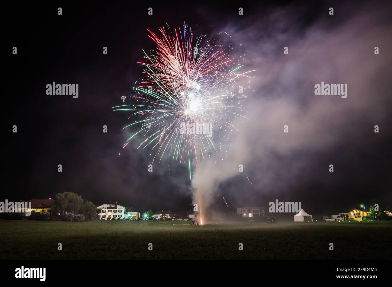 colorful fireworks at night in a meadow Stock Photo - Alamy