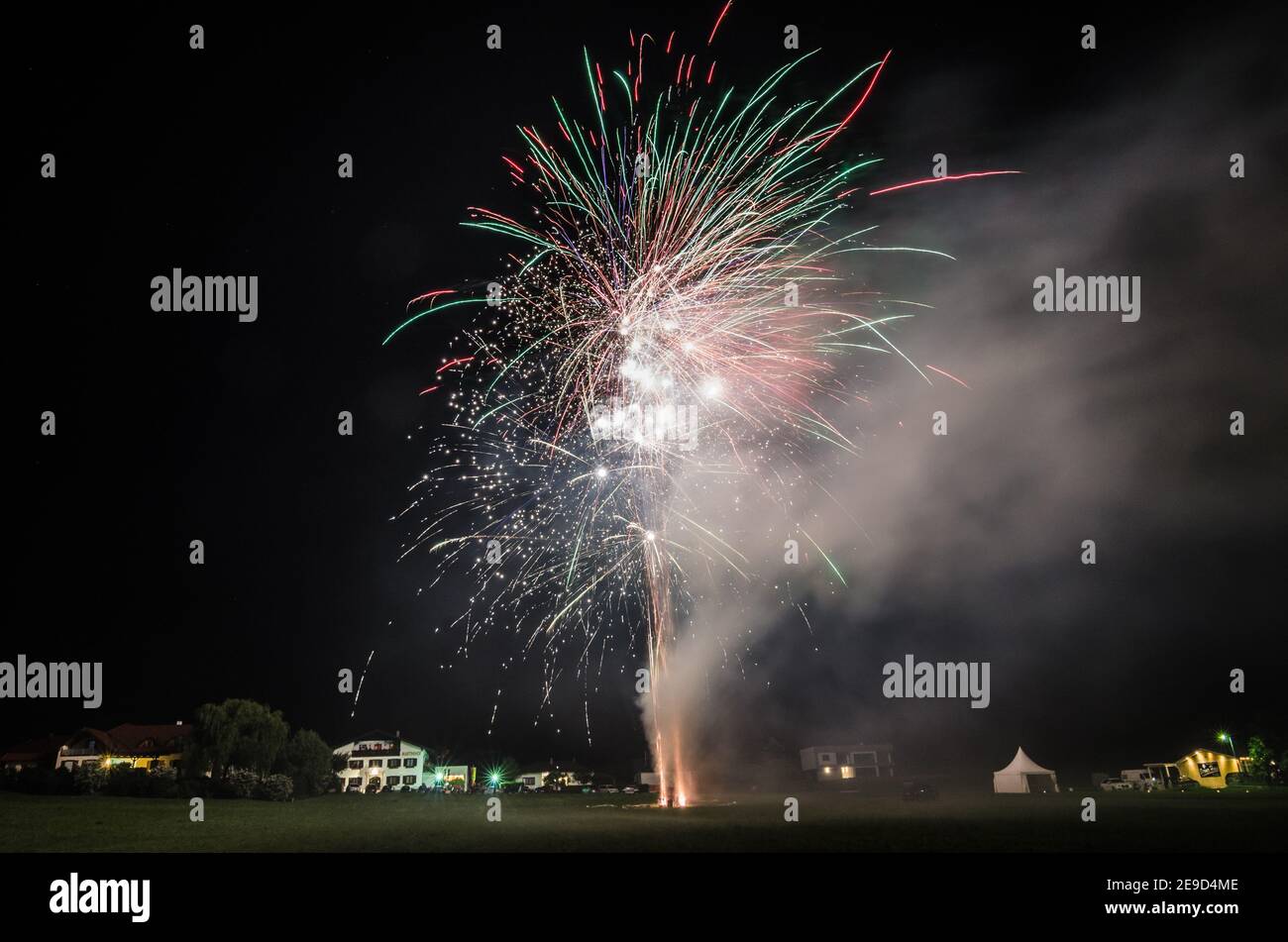colorful fireworks at night with lots of smoke Stock Photo - Alamy