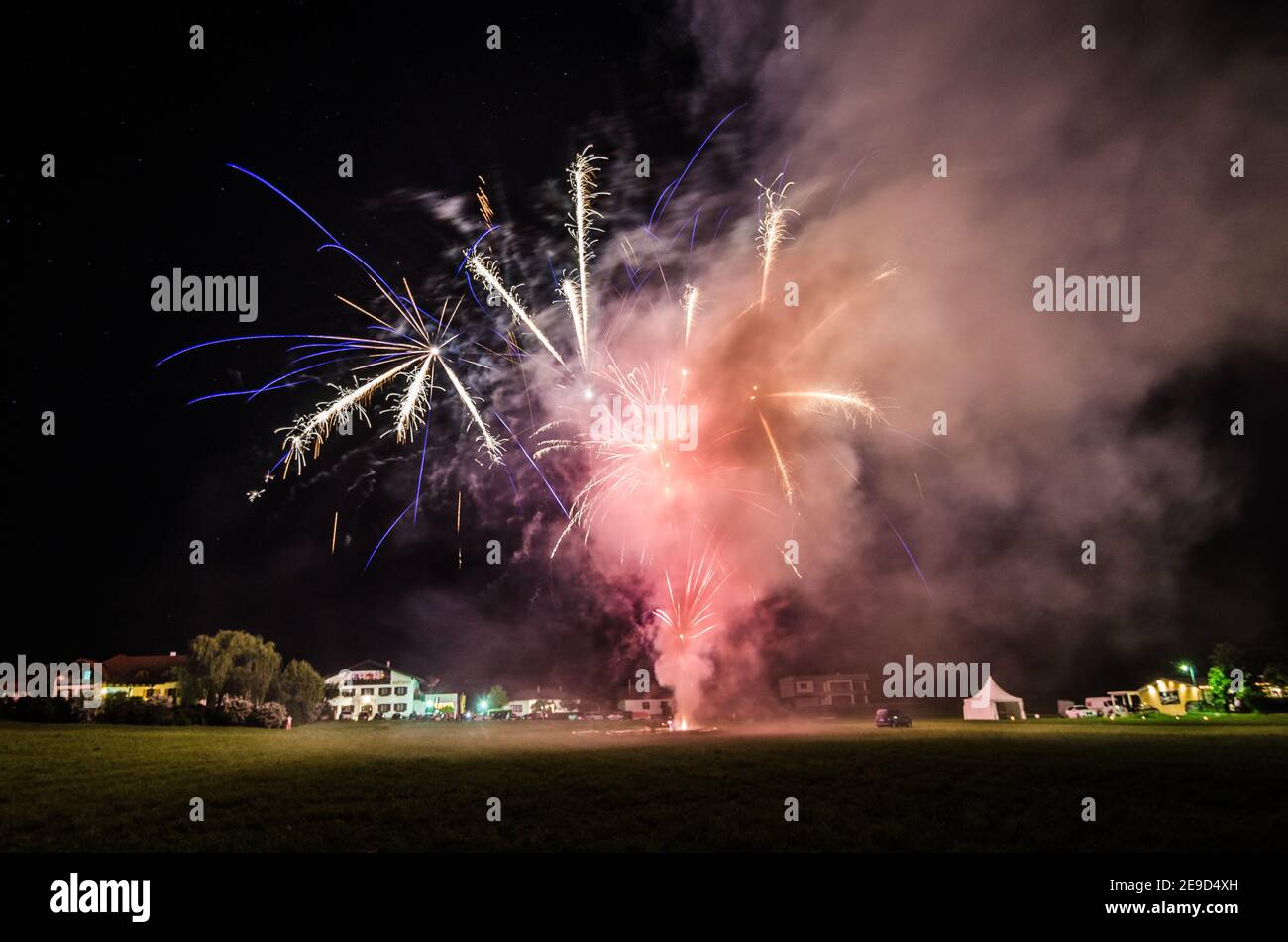 bright colorful fireworks with plenty of smoke Stock Photo - Alamy