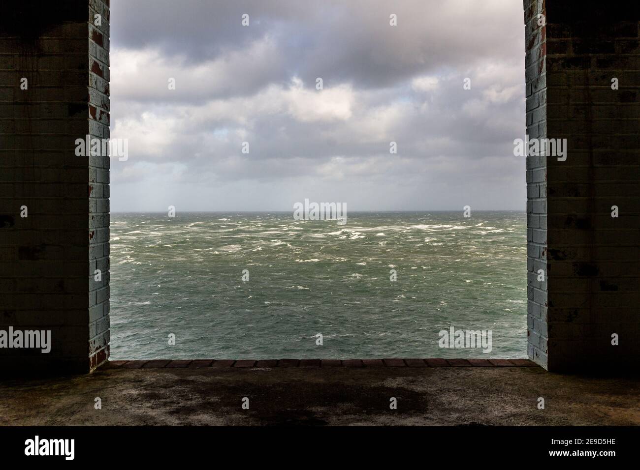 Stormy sea ocean framed in empty window of derelict building. Strumble ...