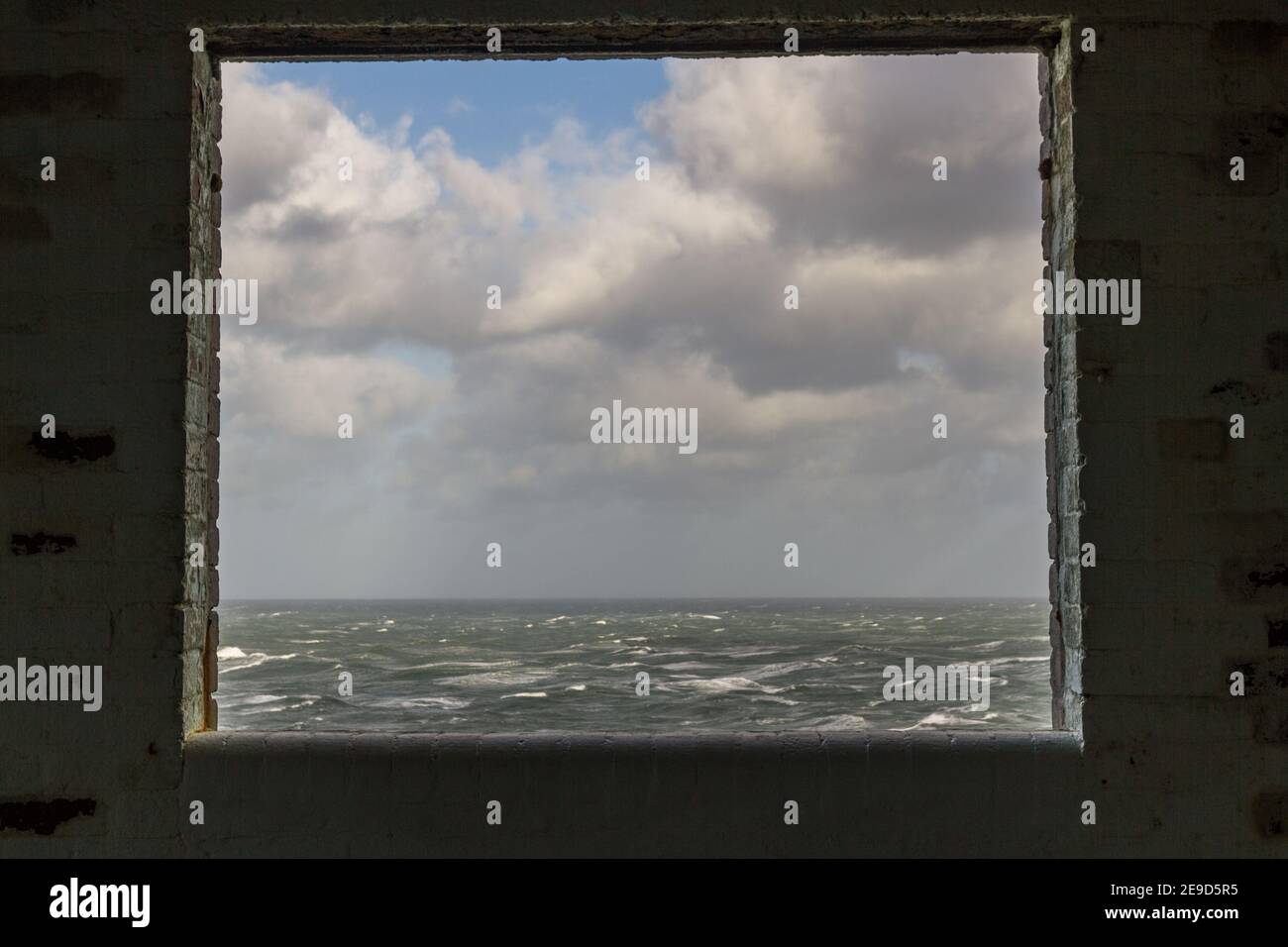 Stormy sea ocean framed in empty window of derelict building. Strumble ...