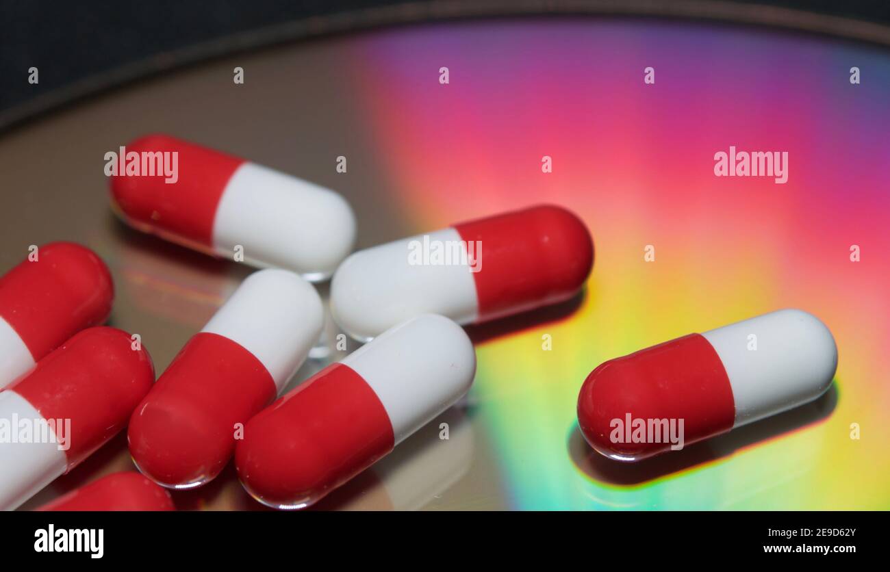 White red capsules on rainbow hi-res stock photography and images - Alamy