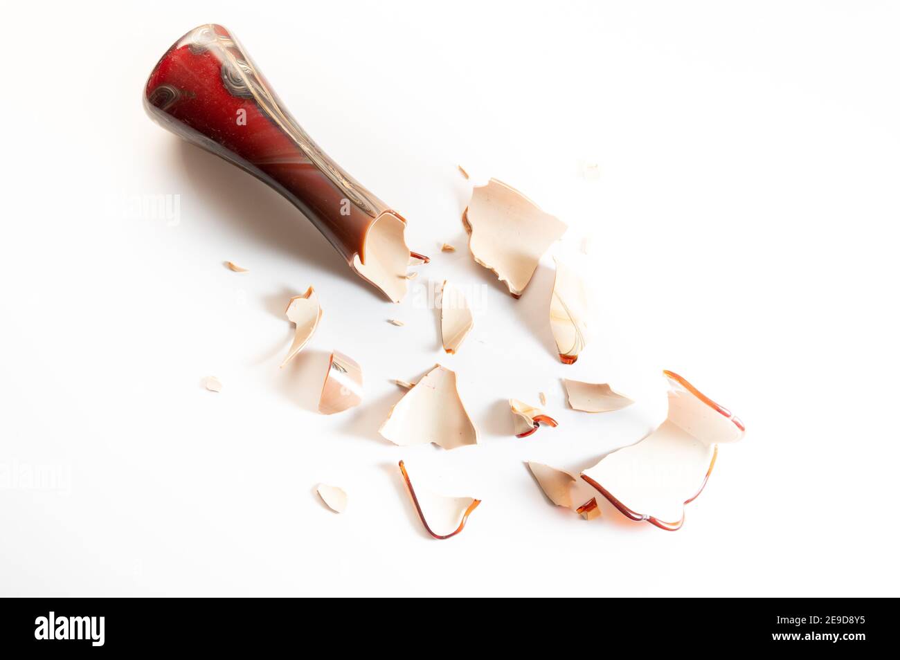 The flower vase is broken into pieces. Broken glass vase. White ...