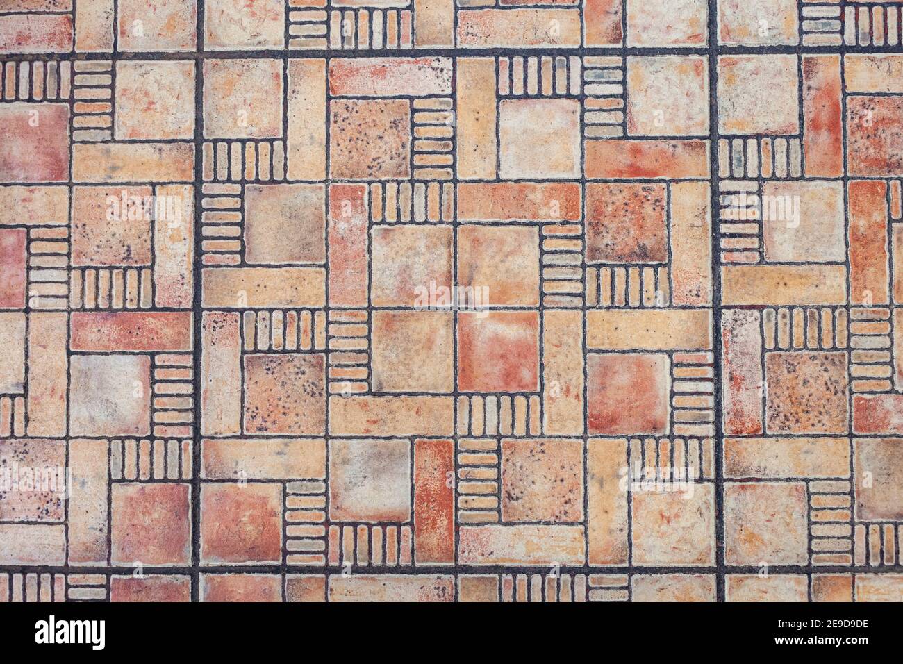 Multi-colored tiles on the floor. Red brown tiles for cafes ...
