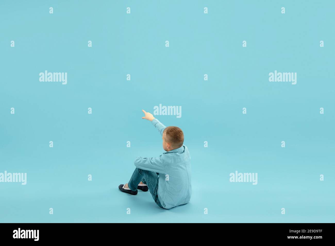 Pointing up. Childhood and dream about big and famous future. Pretty ...