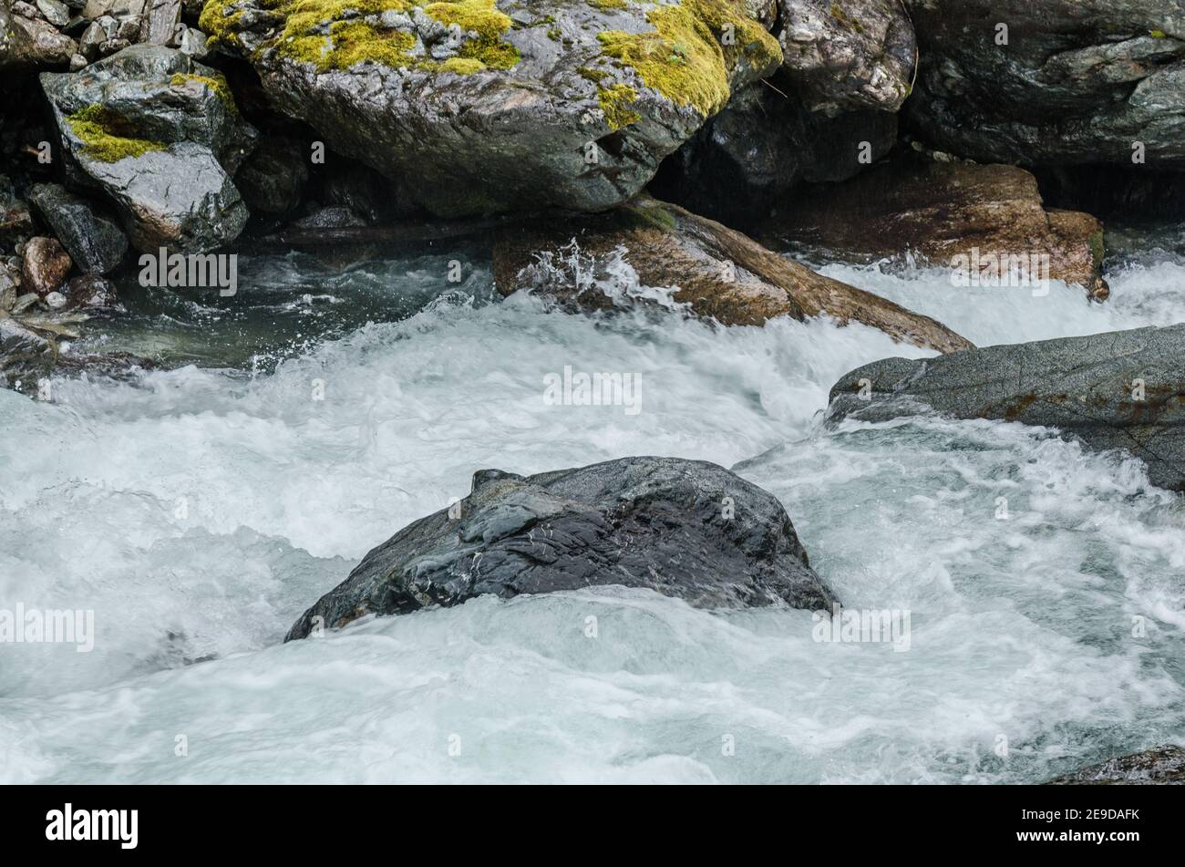foaming water with rocks in the stream Stock Photo - Alamy