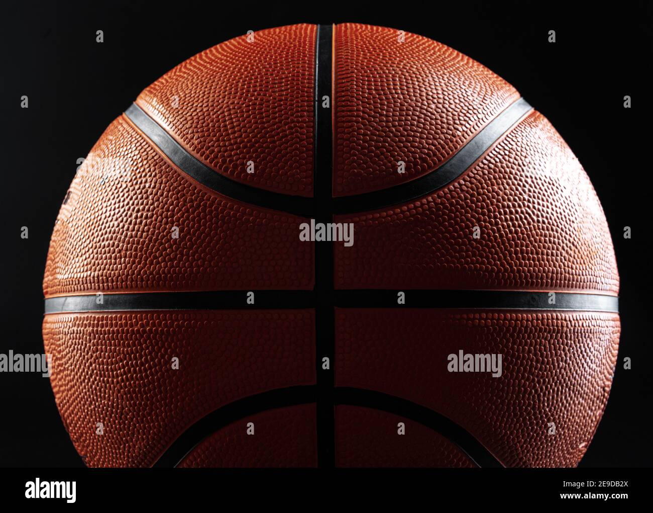 Basketball ball close up on dark black background Stock Photo - Alamy