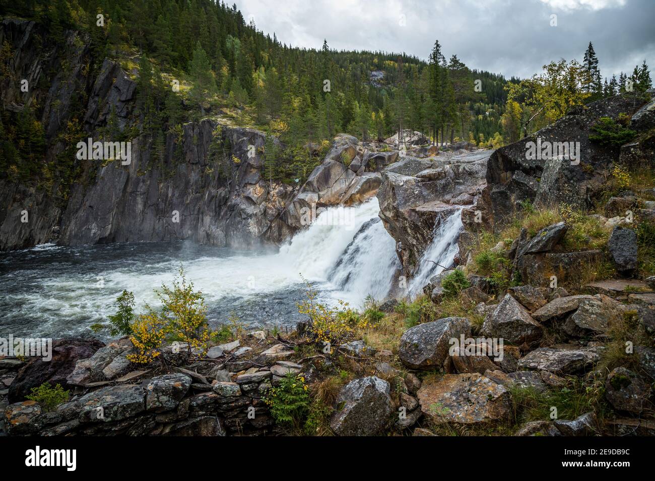 Hyttfossen waterfall in autumnal scenery. Beautiful fall in middle ...