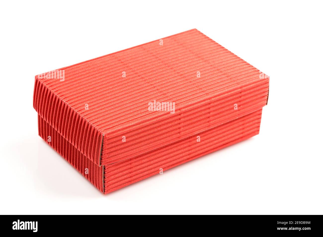 Red closed corrugated cardboard box isolated on white. Valentine's Day ...
