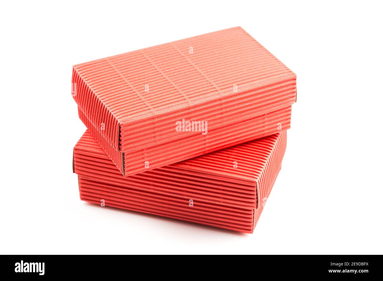 Two red closed corrugated cardboard boxes isolated on white. Valentine ...