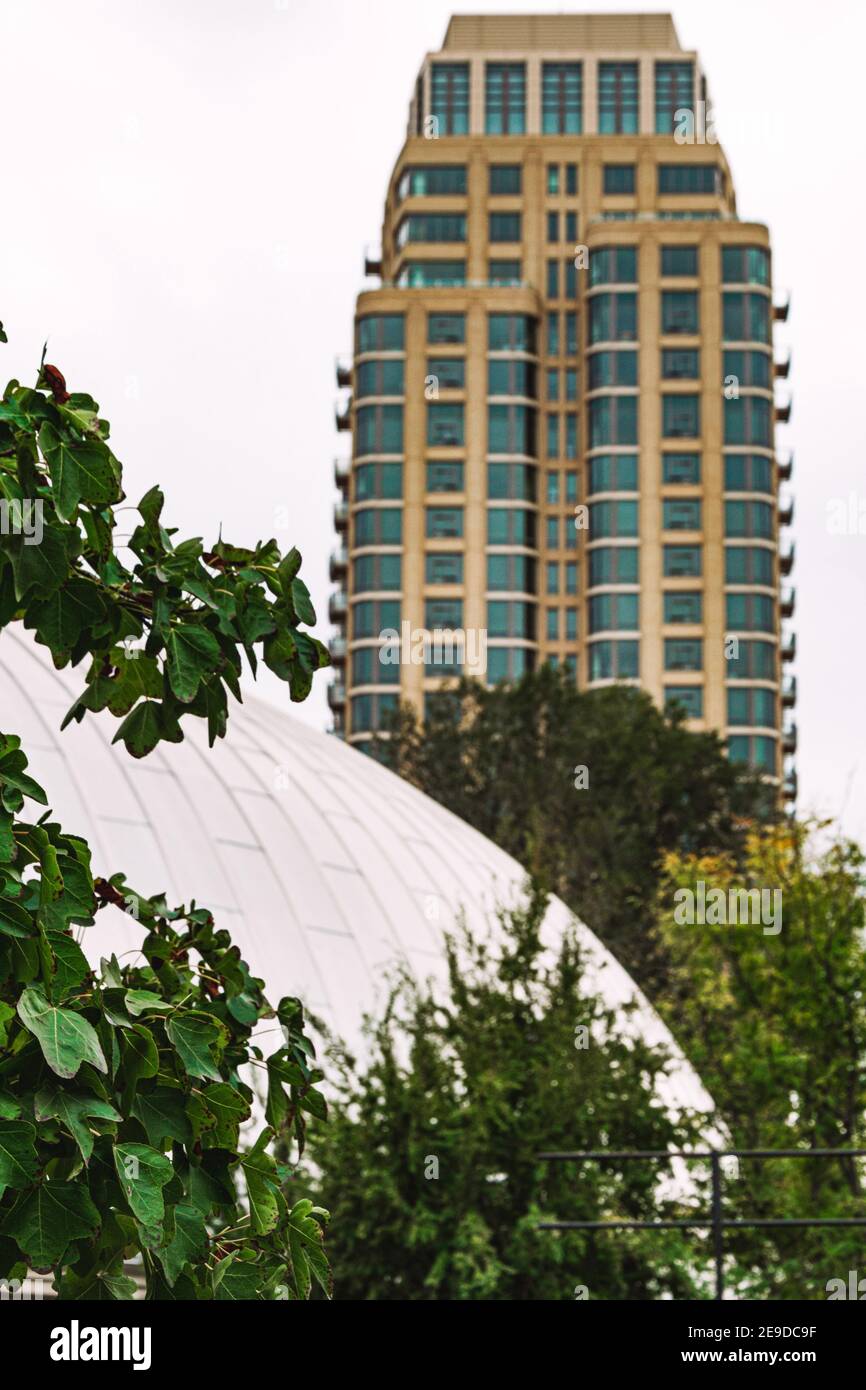 Vertical shot of a high-rise building with glass and metal in the ...