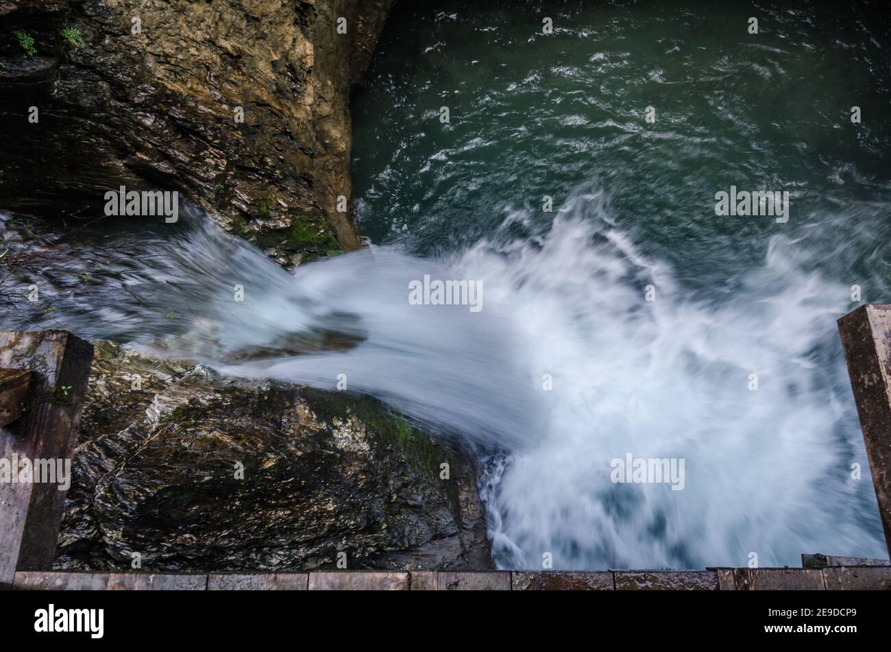 falling water in ravine in the mountains Stock Photo - Alamy