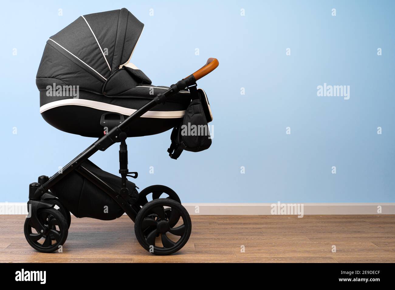 Baby stroller indoor. Empty place for text Stock Photo - Alamy