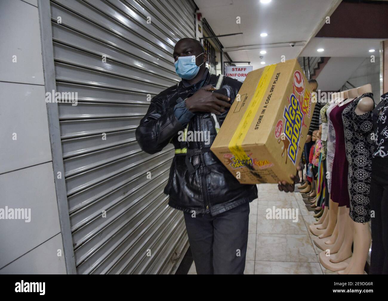 Nairobi, Kenya. 22nd Jan, 2021. Moses Otieno, a deliveryman, carries ...