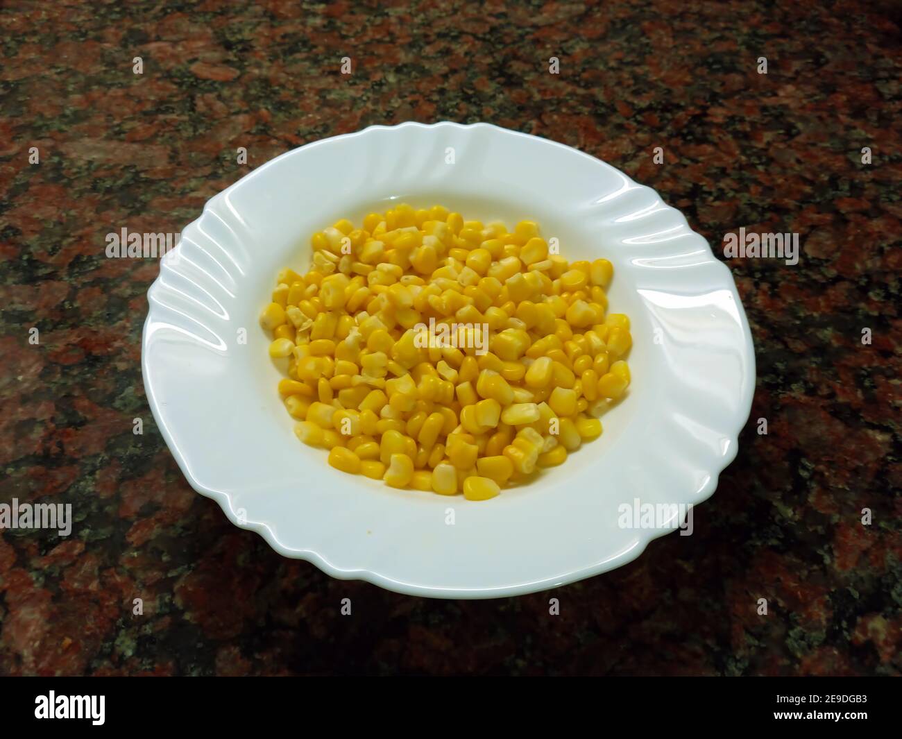 Boiled corn kernels in white hi-res stock photography and images - Alamy