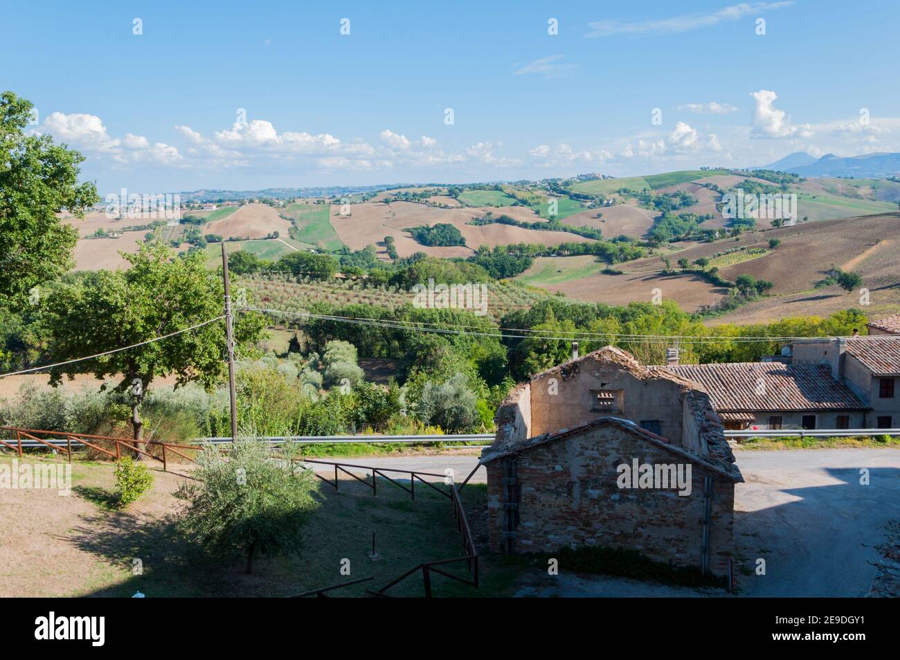 Beautiful scenery of a small ruined house and green hills in front of ...