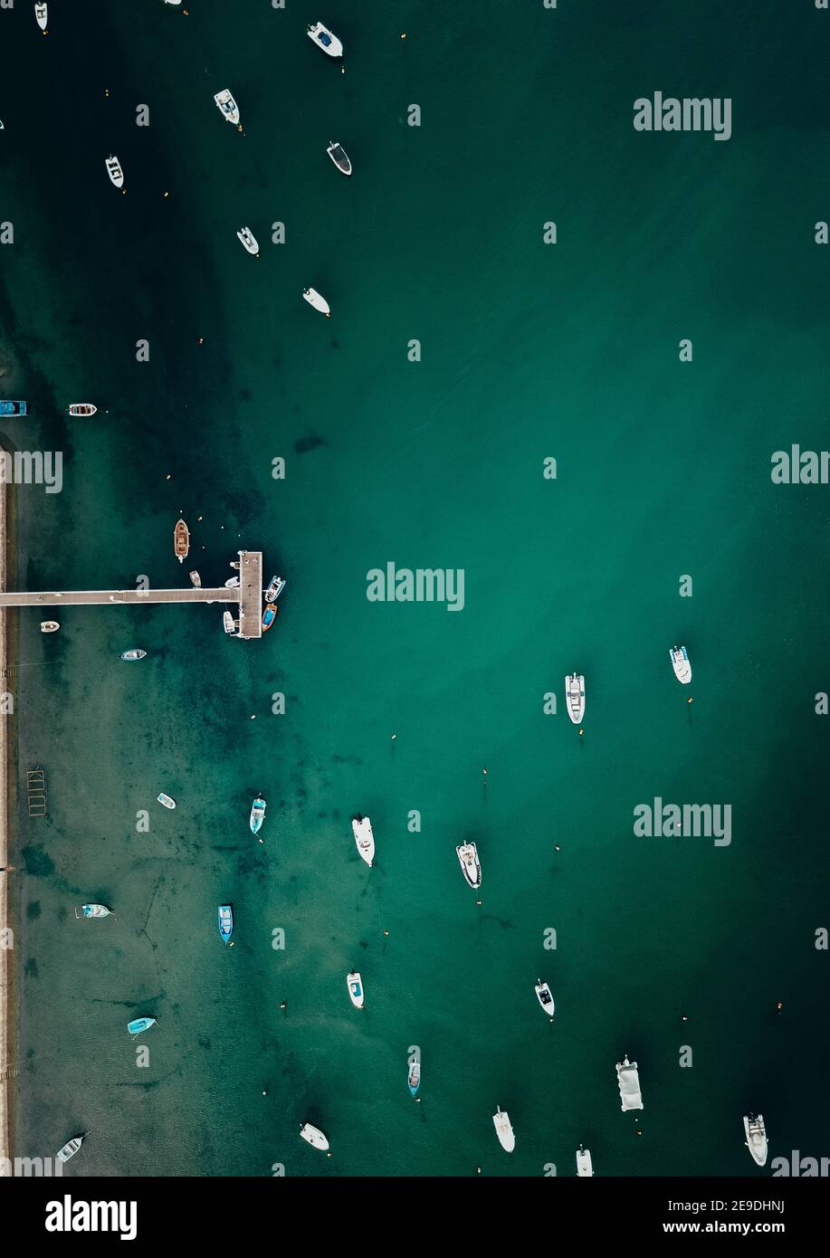 Boats by the River Pier Stock Photo - Alamy