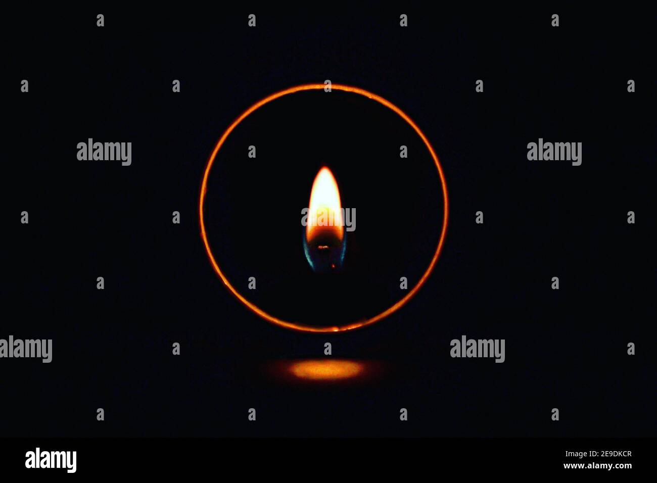 Long exposure fire ring around the burning candle flame glowing in the ...