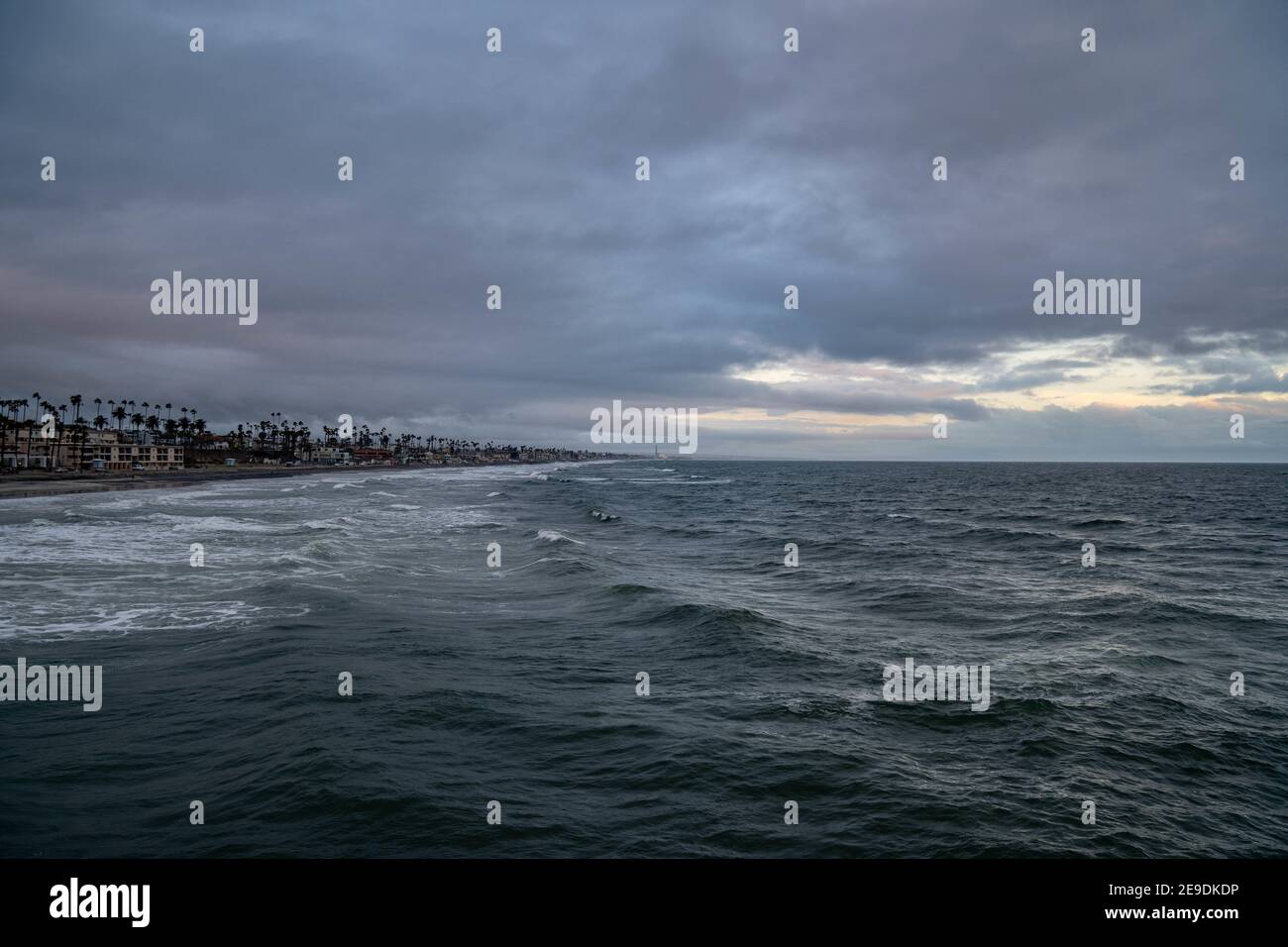 Wavy sea and a shore under the cloudy sky - perfect for background ...