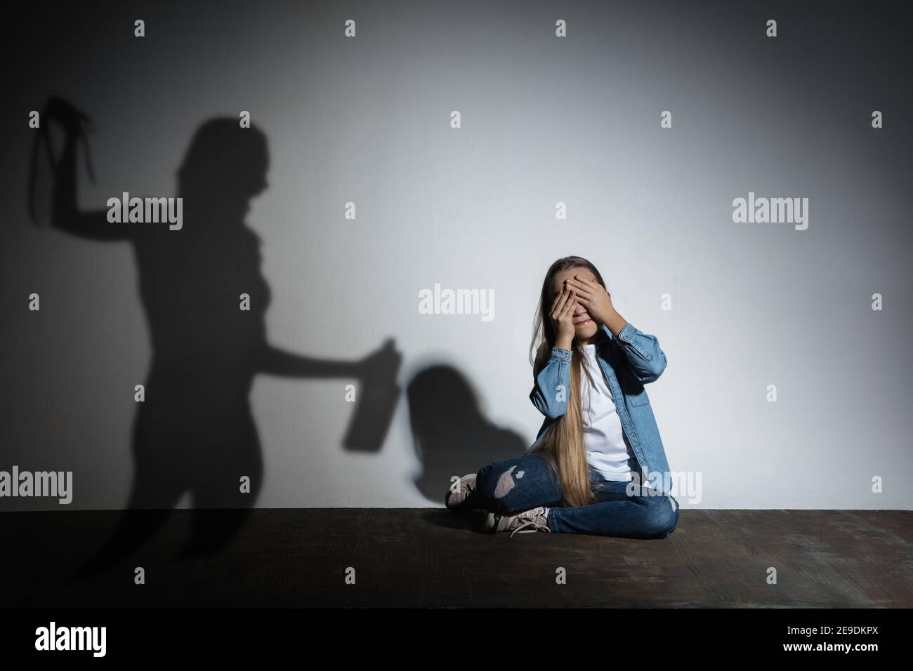 Domestic physical violence, abusing. Scared little caucasian girl ...