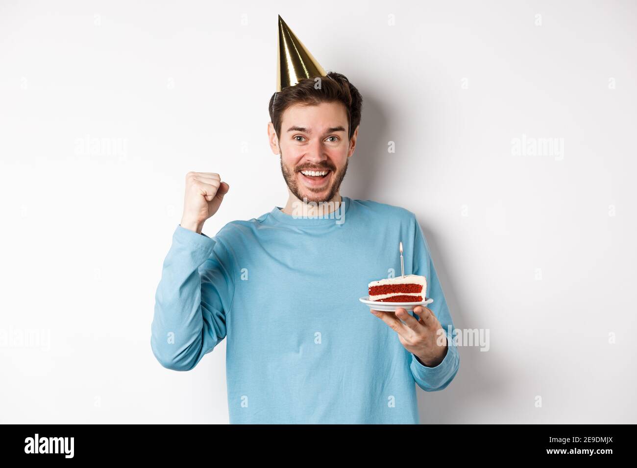 Celebration and holidays concept. Cheerful young man celebrating ...