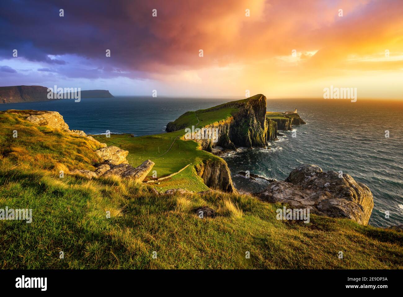 Colourful sunset at Neist Point lighthouse in Scotland. Isle of Skye ...