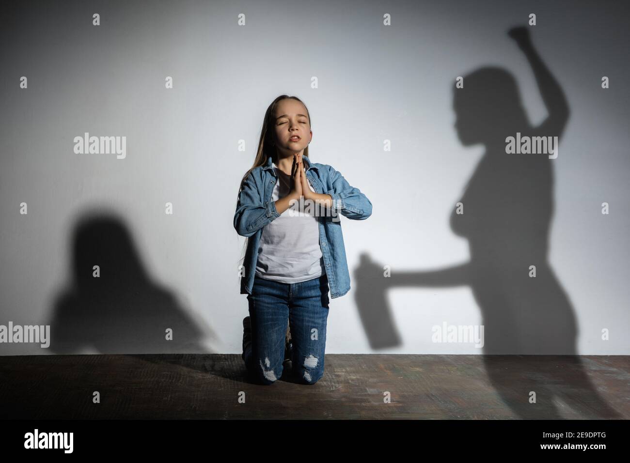 Domestic physical violence, abusing. Scared little caucasian girl ...