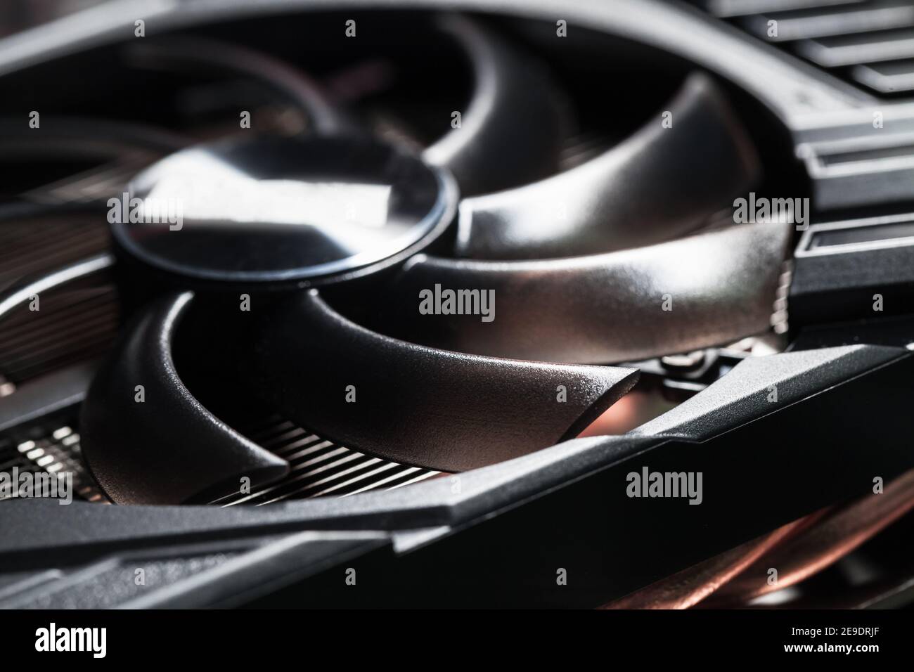 New shiny black plastic GPU cooler, close-up photo with selective focus ...