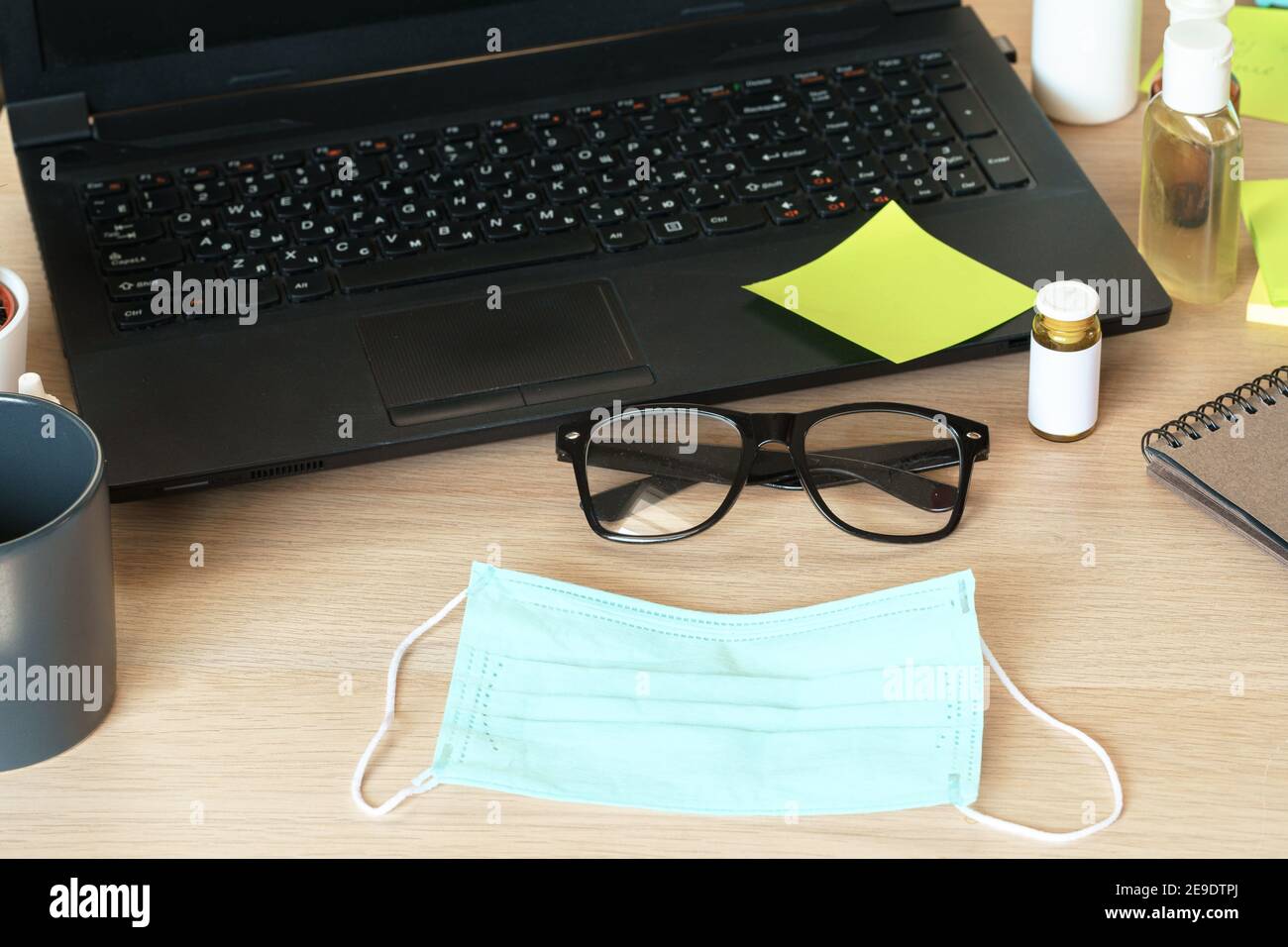 Medical protective mask on office table. Coronavirus spread prevention ...