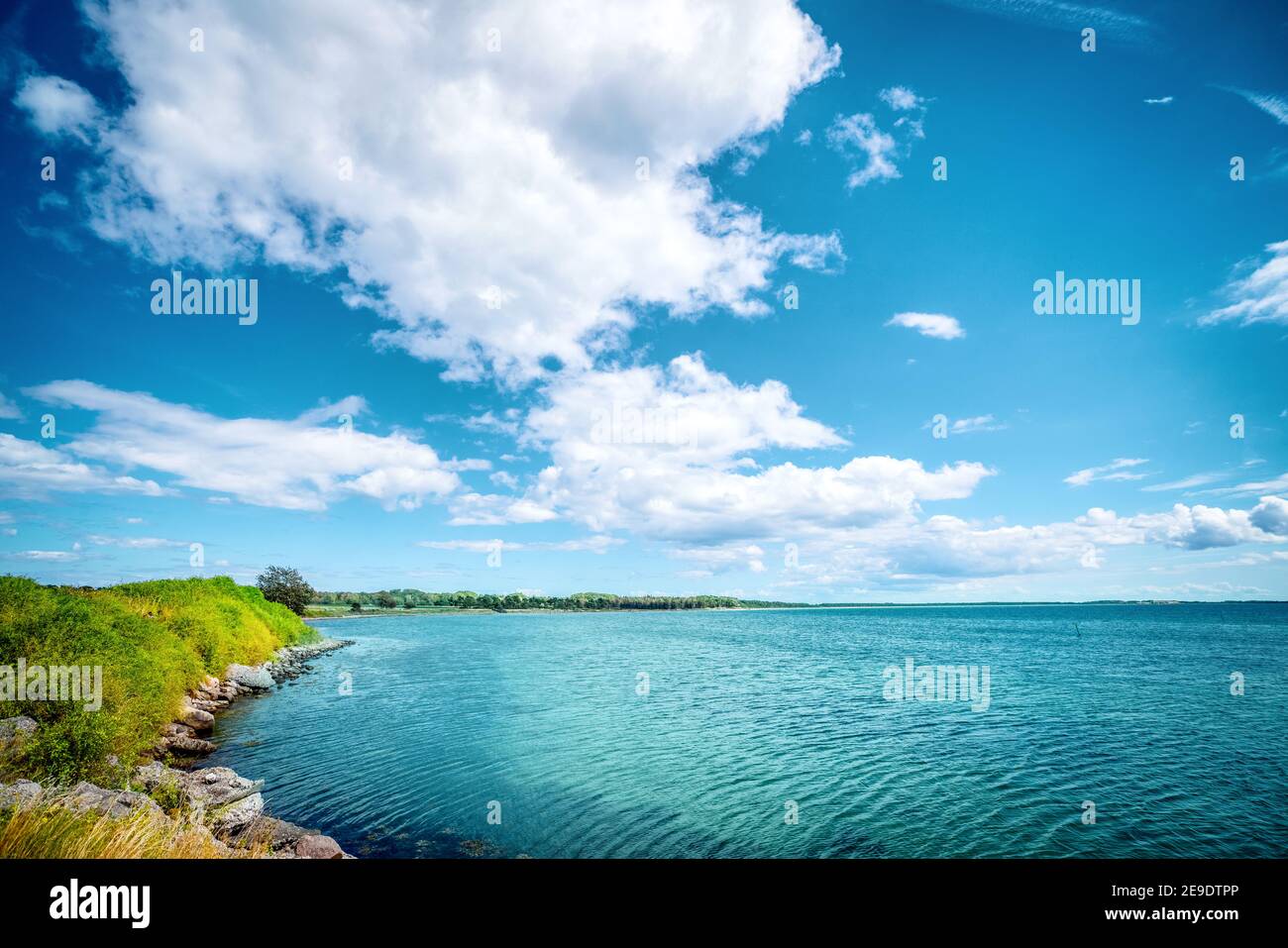 Idyllic lake with turquoise water in the summer with rocks by the ...