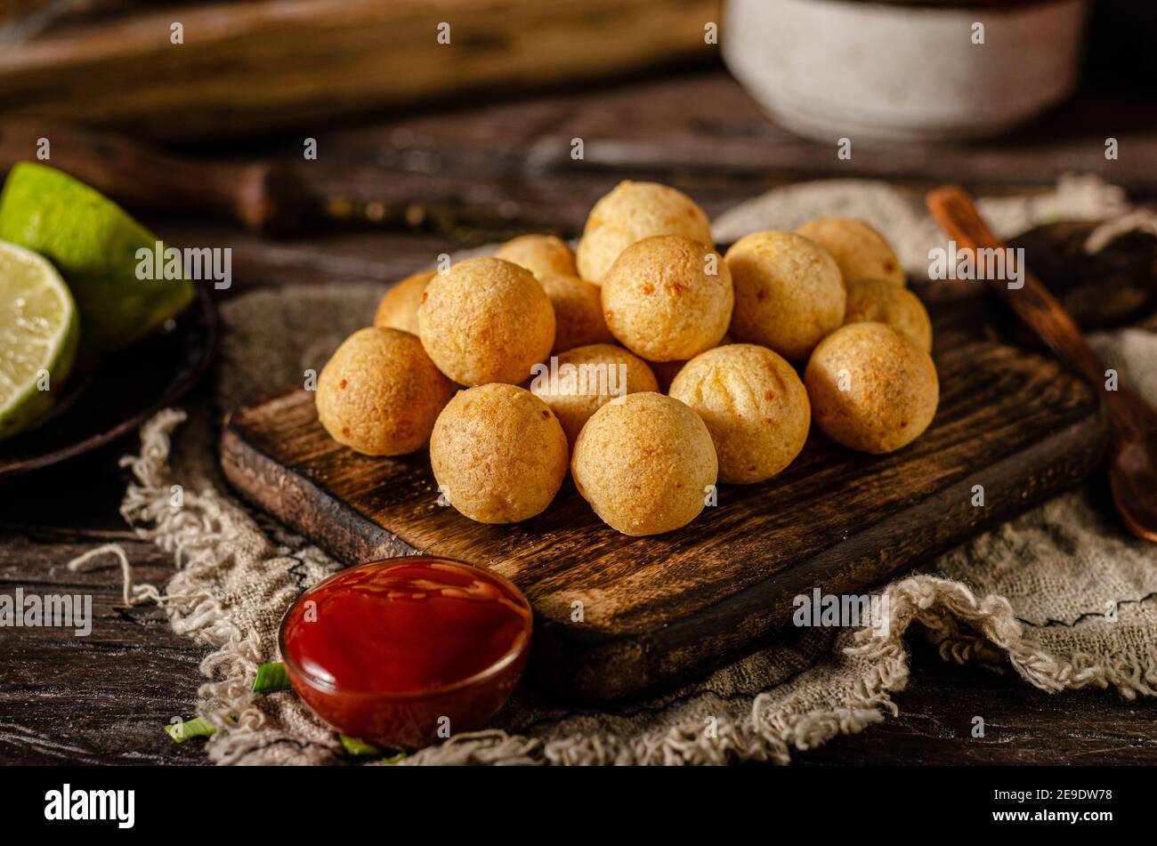 Rounded croquettes with hot sauce and cheese Stock Photo - Alamy