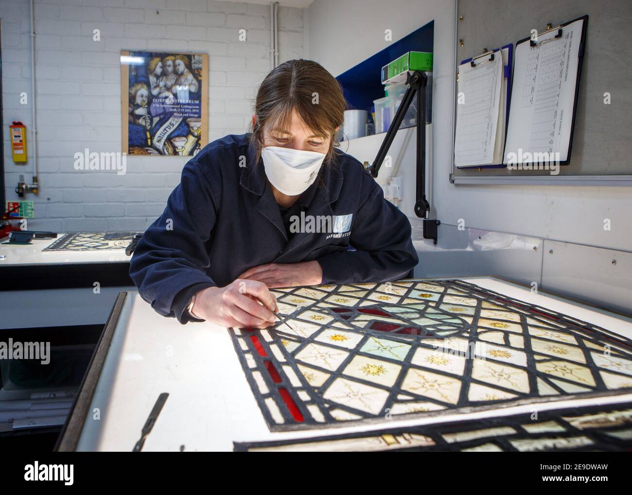 Conservator Alison Gilchrist works on large stained glass windows from ...