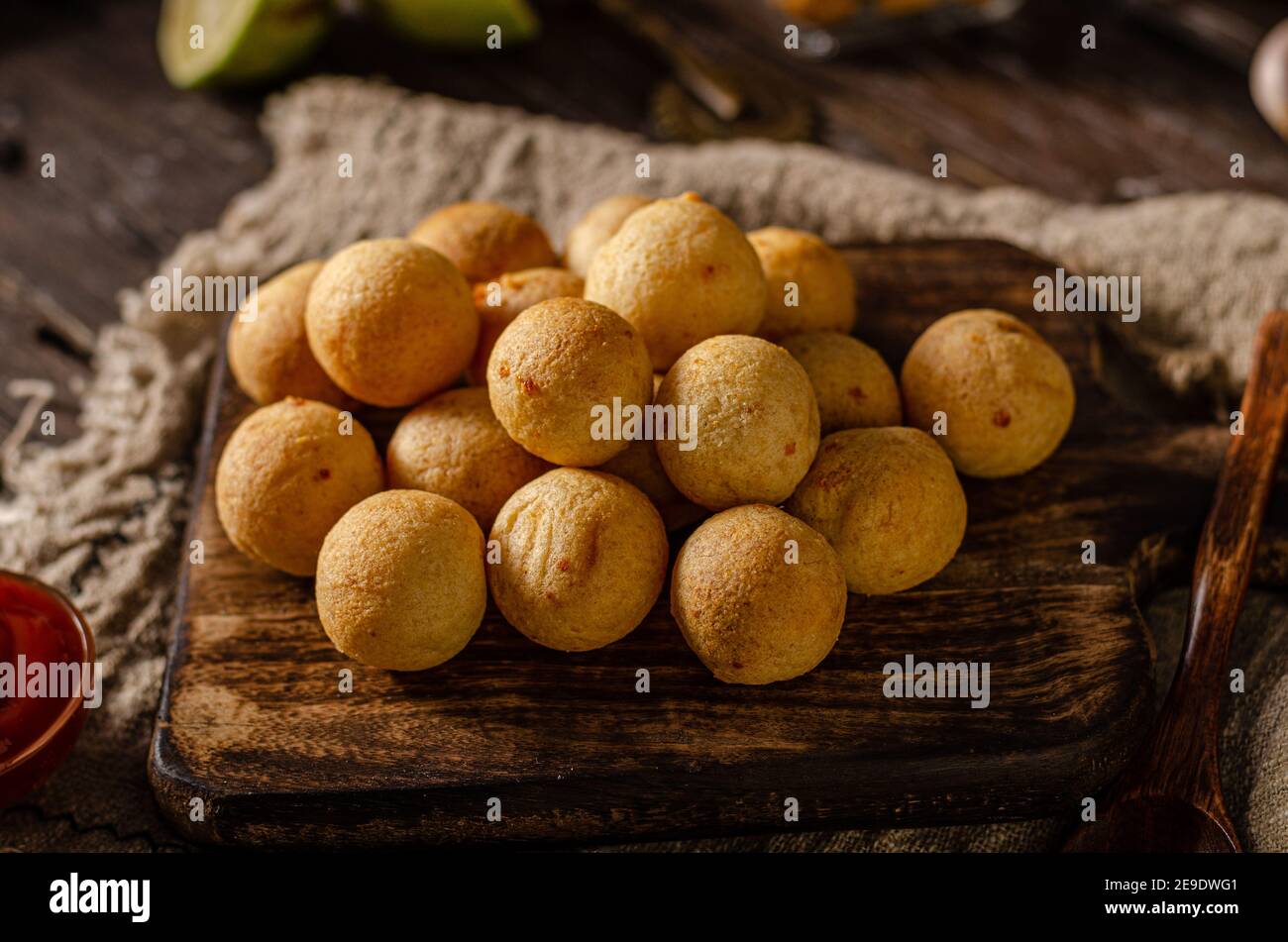 Rounded croquettes with hot sauce and cheese Stock Photo - Alamy
